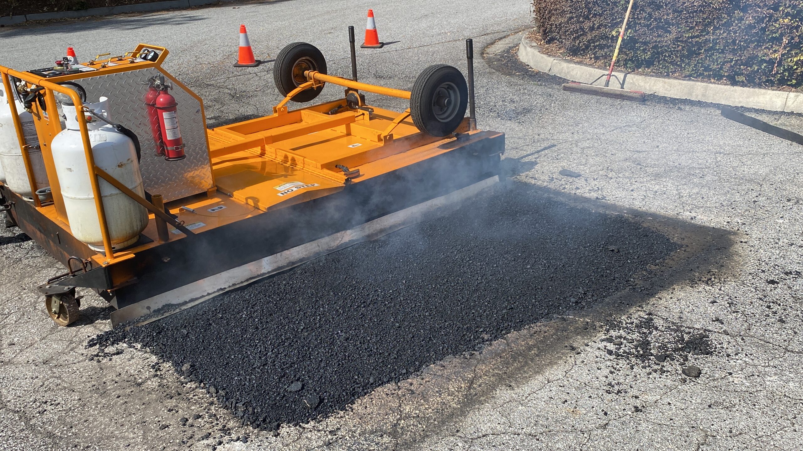 Different Techniques for Filling Potholes in Asphalt - BCS Services